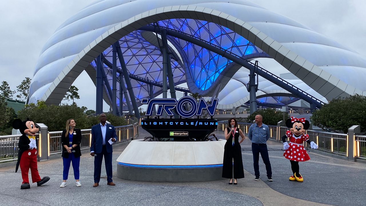 Disney cast members celebrate opening of TRON