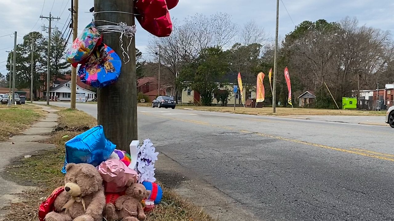 Rocky Mount 911 operator and son being laid t rest