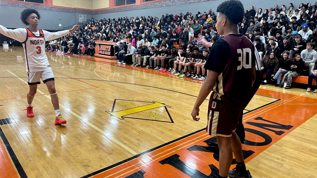 North boys basketball unveils title banner, beats Doherty