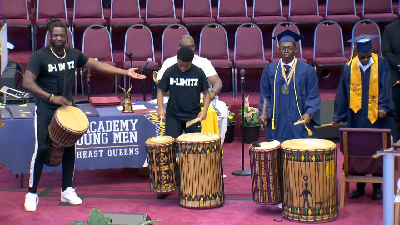 Drum band at Queens school performs at graduation ceremony