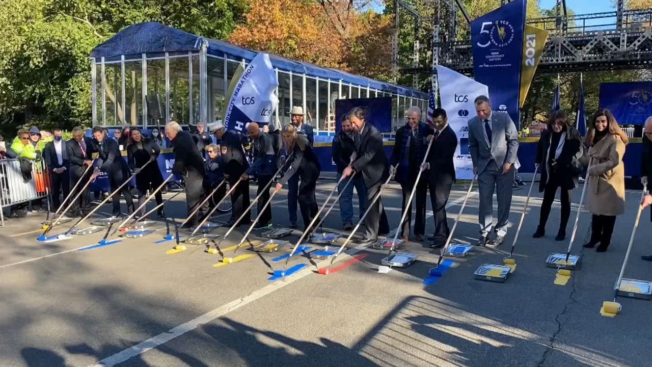 Blue line painting kicks off festivities for NYC Marathon