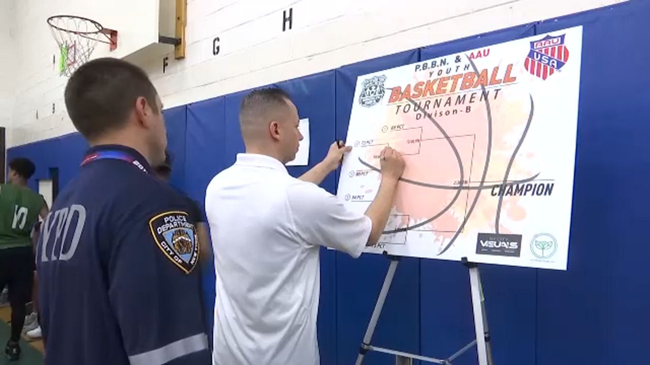 NYPD officers hit the basketball court with Brooklyn teens