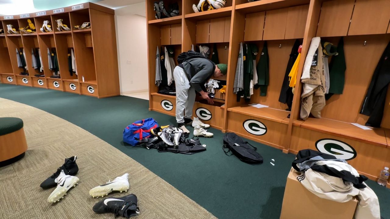 Packers players clean out their lockers