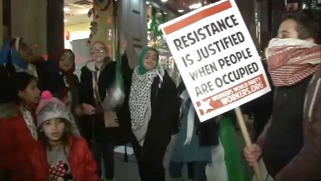 Protesters march from Times Square to Trump Tower to oppose Israel decision