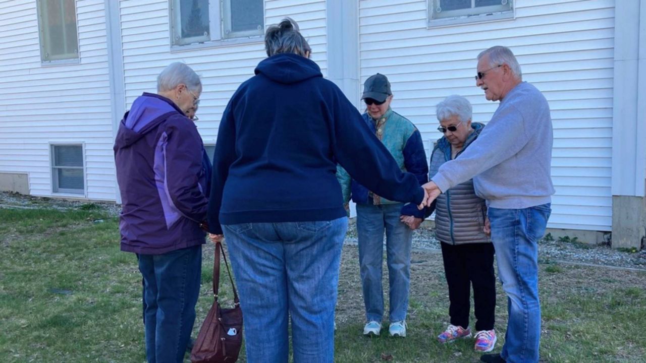 Maine town shaken by violence remembers slain friends