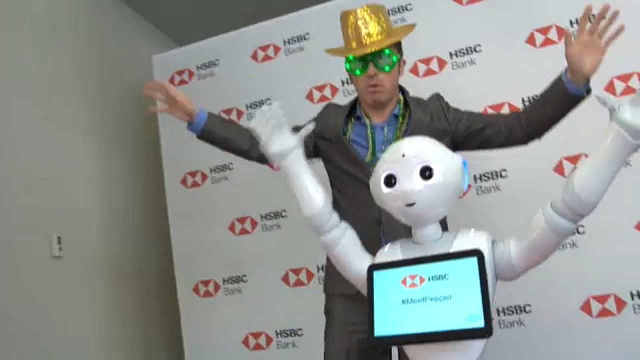 Virtually Rick Meets a Social Humanoid Robot Banker
