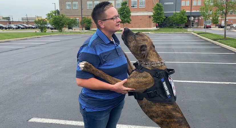 Police officer using emotional support dog