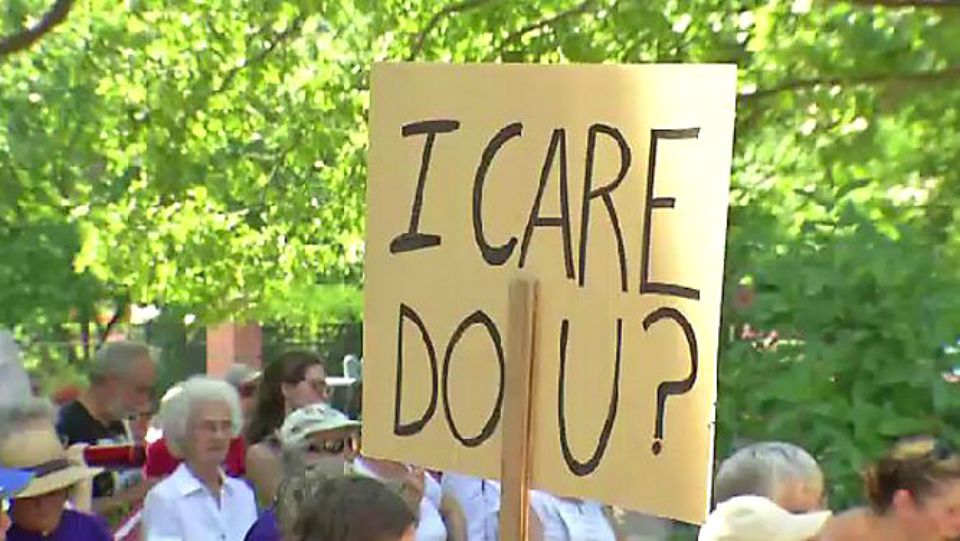 Hundreds stand together at 'Families Belong Together' rally