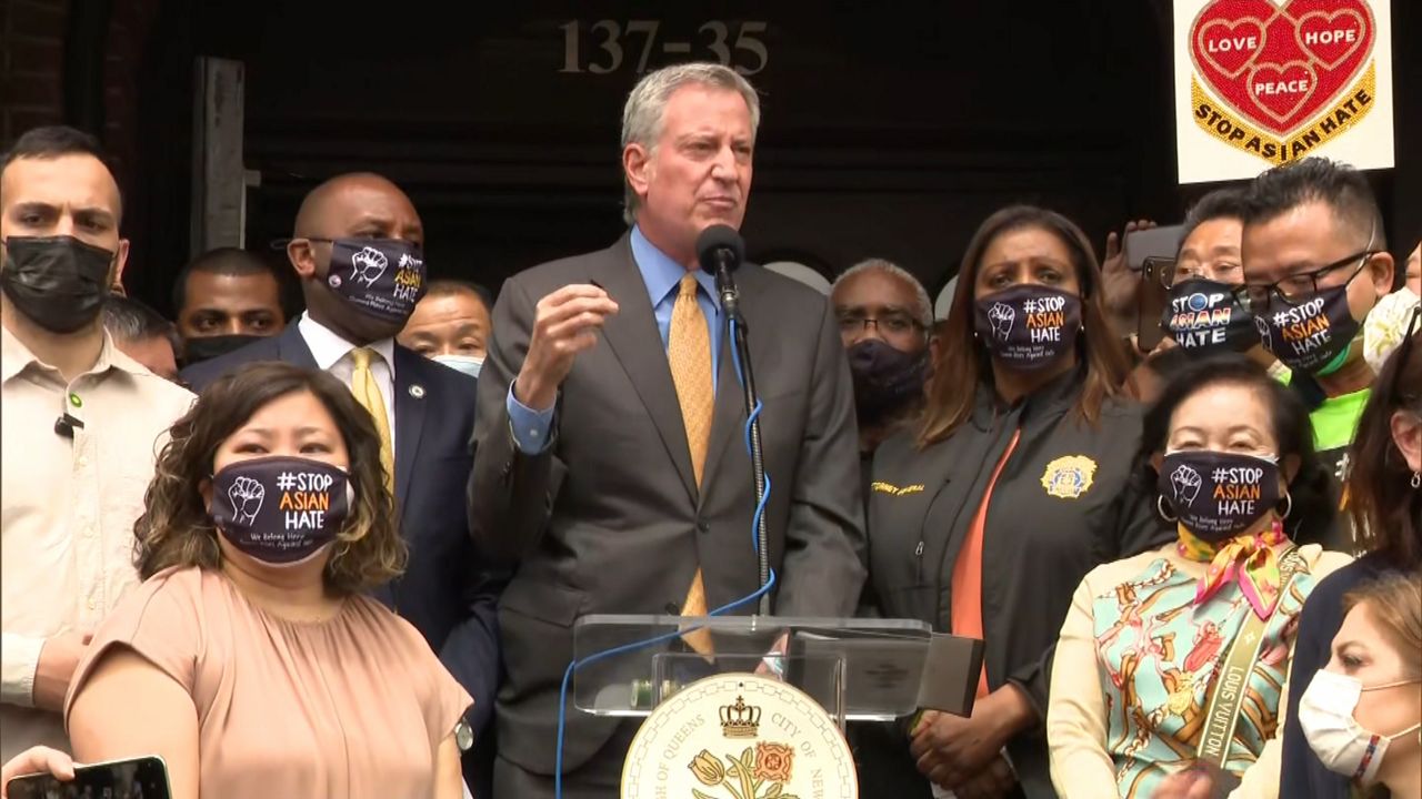 Elected officials and advocates march against anti-Asian hate in Queens