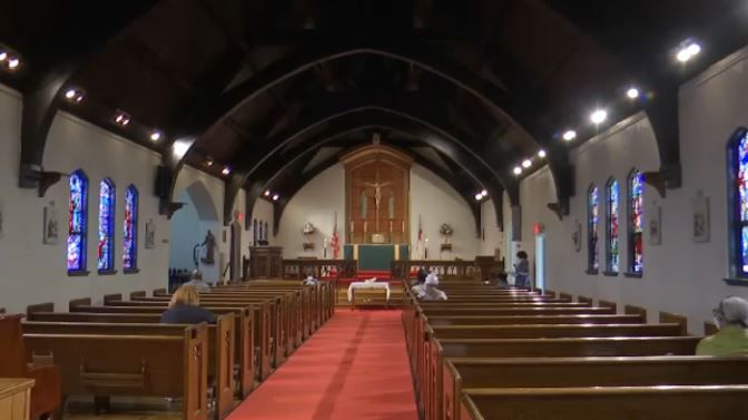 Queens church parishioners return but with masks