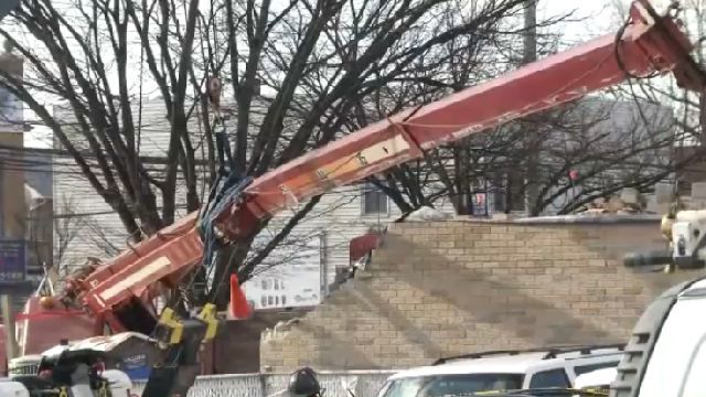No injuries after boom truck tips over at Queens construction site