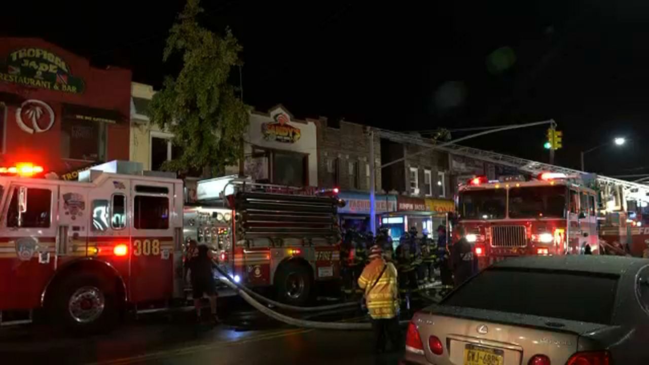 Fire damages businesses and injures two firefighters