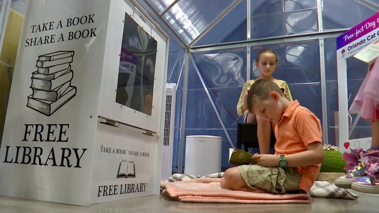 Reading program pairs kids with pawsitive role models