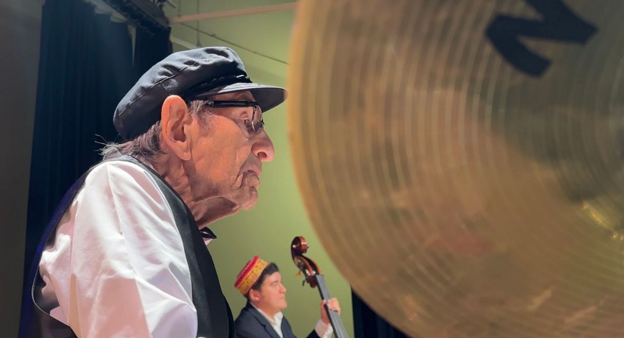 Holocaust survivor spreads love with music