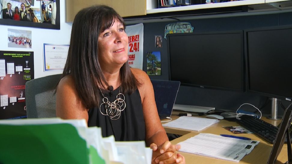 Veteran reporter Holly Cain racing toward the checkered flag