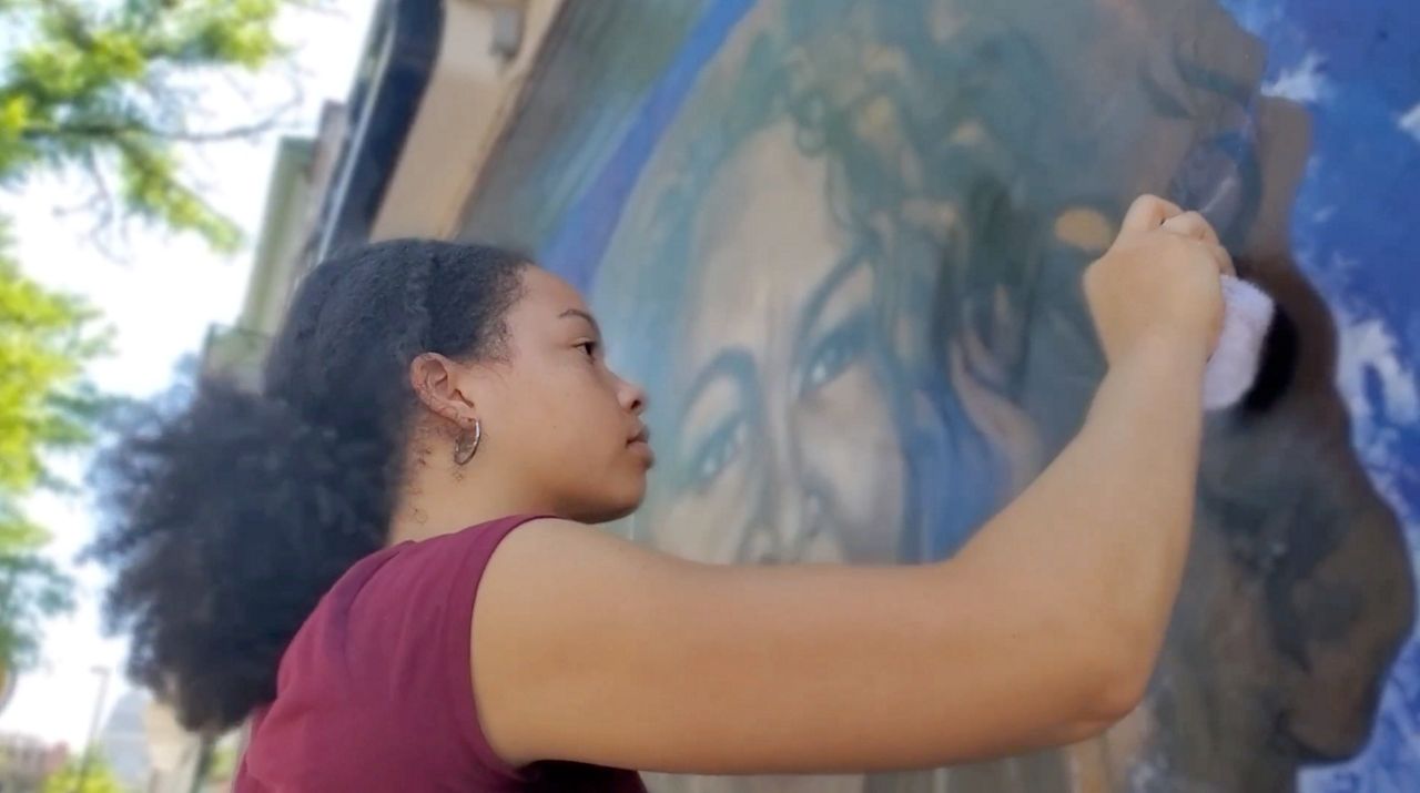 Mural project grows larger as artists are paid for service