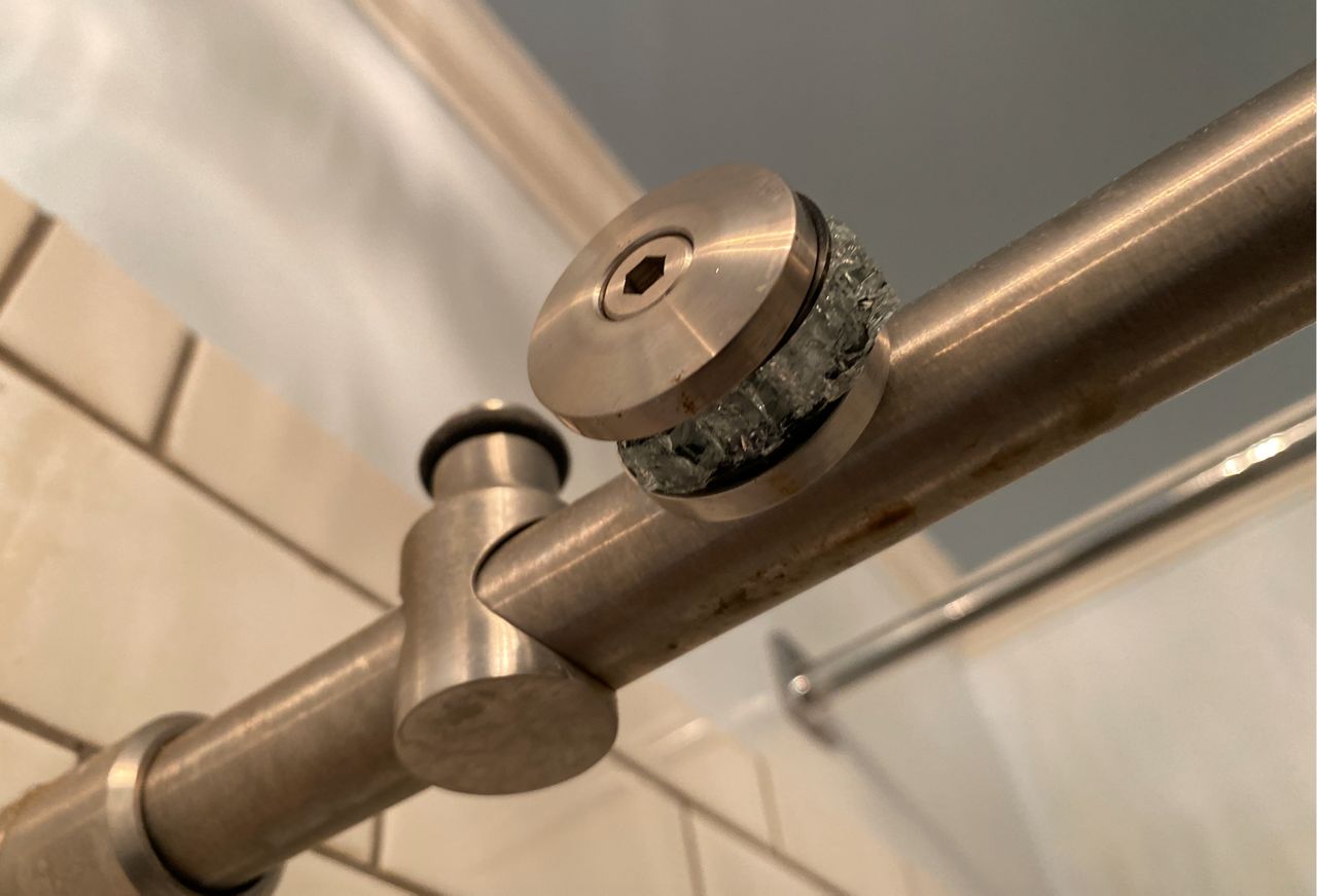 Homeowners' glass shower door spontaneously shatters