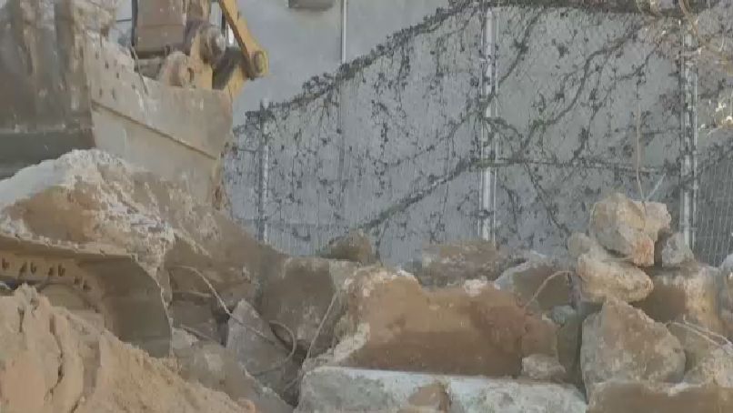 Crews Demolish Historic Stone Wall