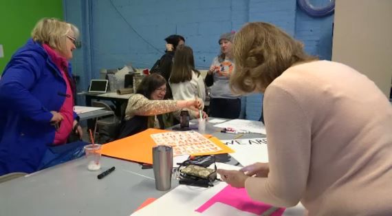 Women create signs to prepare for 2nd annual march on manhattan