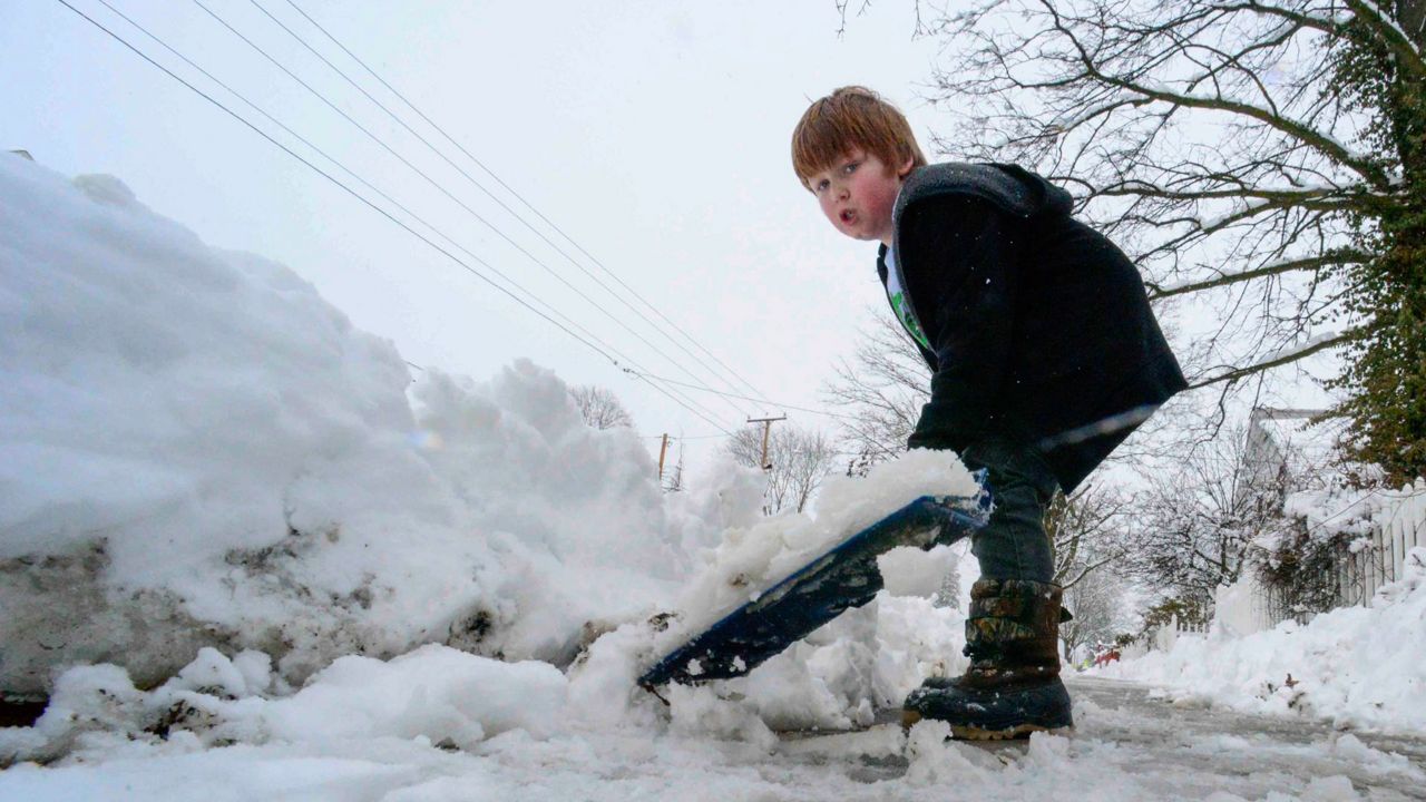 Heavy snow slams New England; storm cleanup begins in South