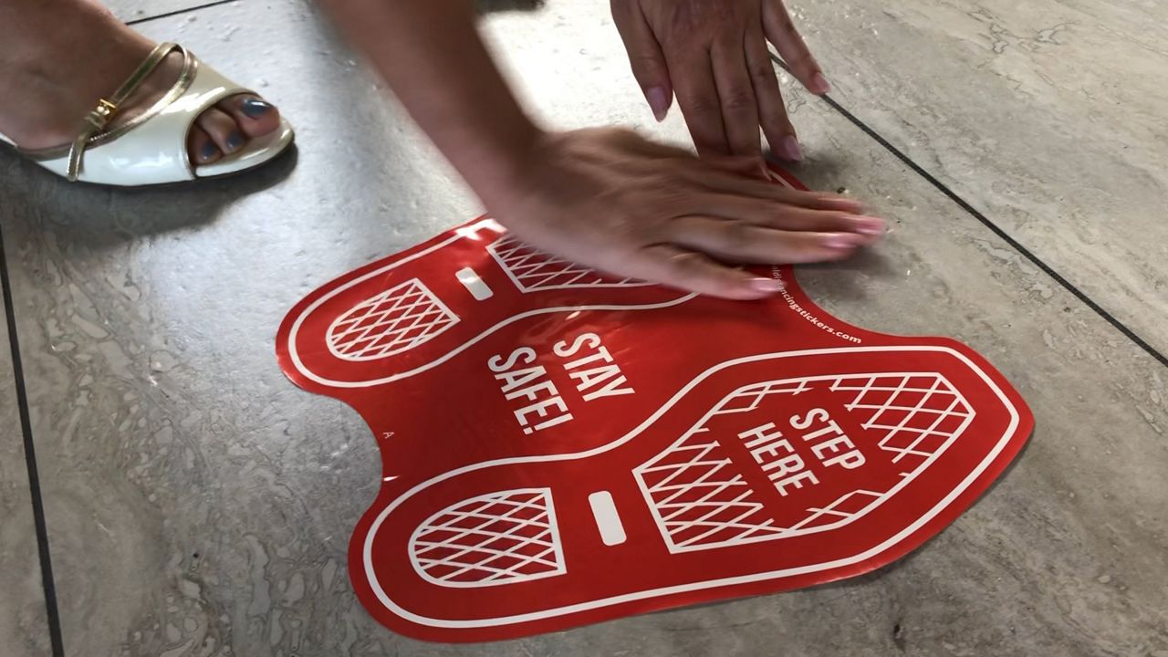 Businesses Place Sticky Social Distancing Reminders