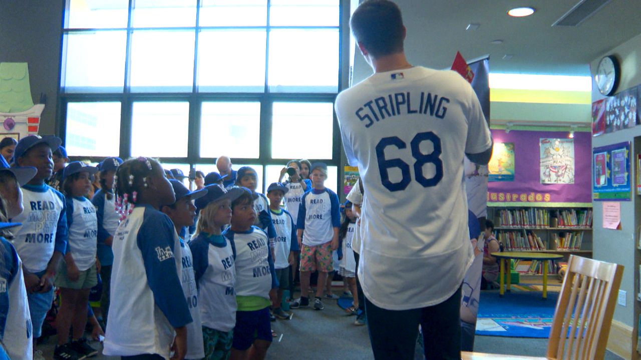 Ross Stripling Reads to Students as Part of Reading Series