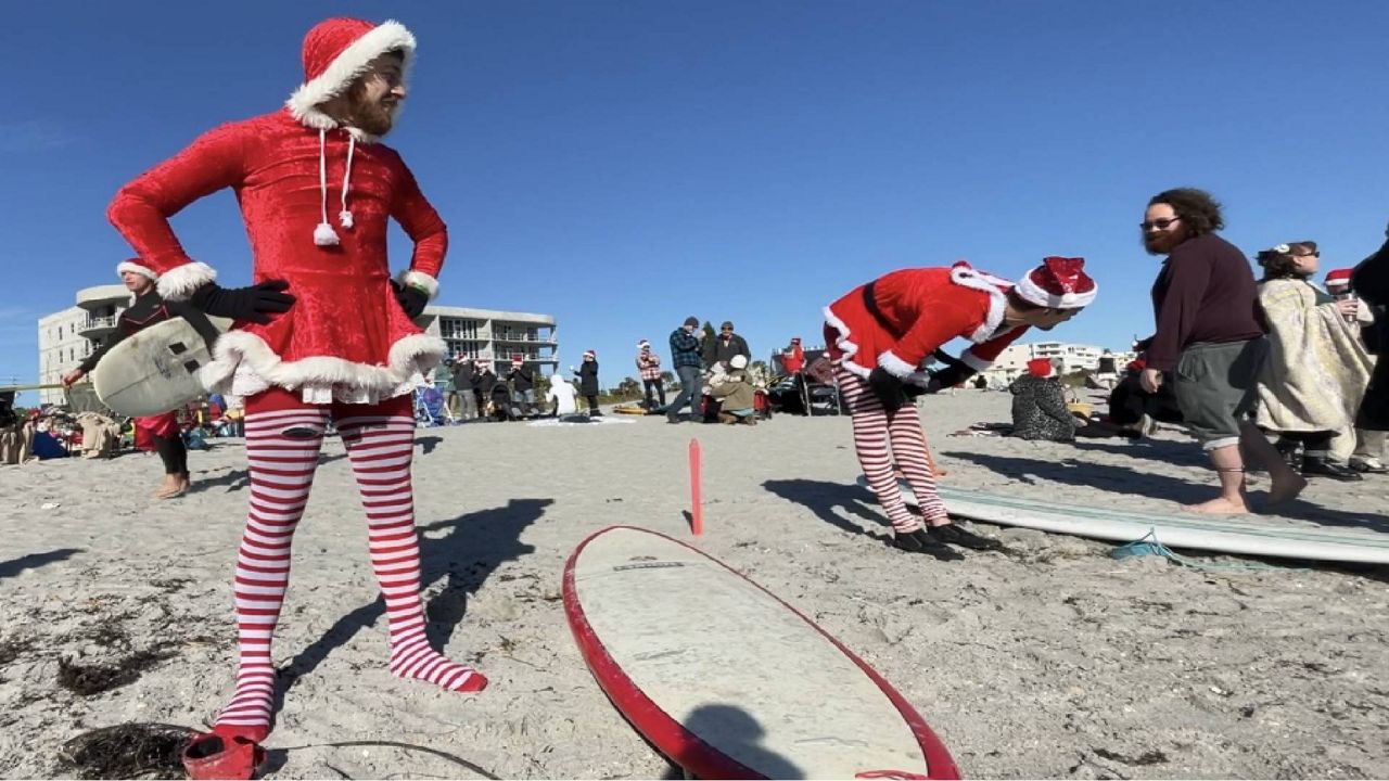 Surfing Santas hit the waves despite grueling temps