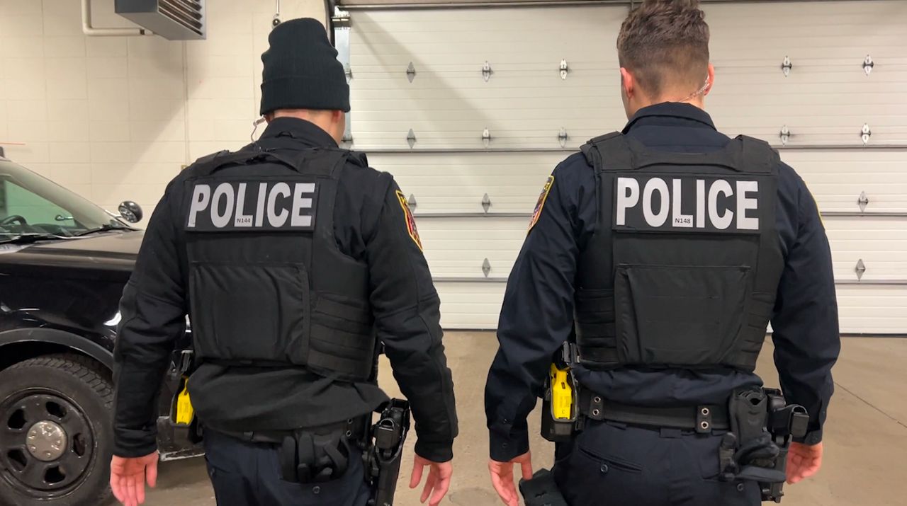 Identical twin officers serve together in the Neenah