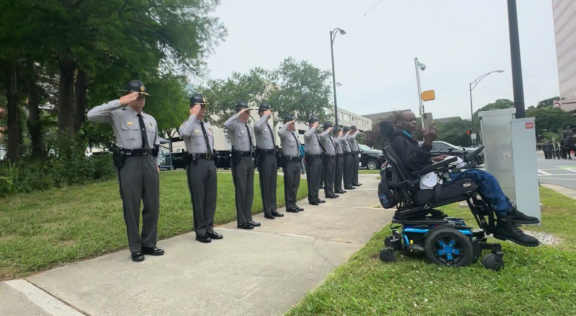 Neighbors pay respect to officer killed in line of duty