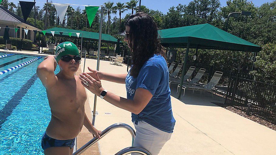 11-year old swims for mom to fight cancer