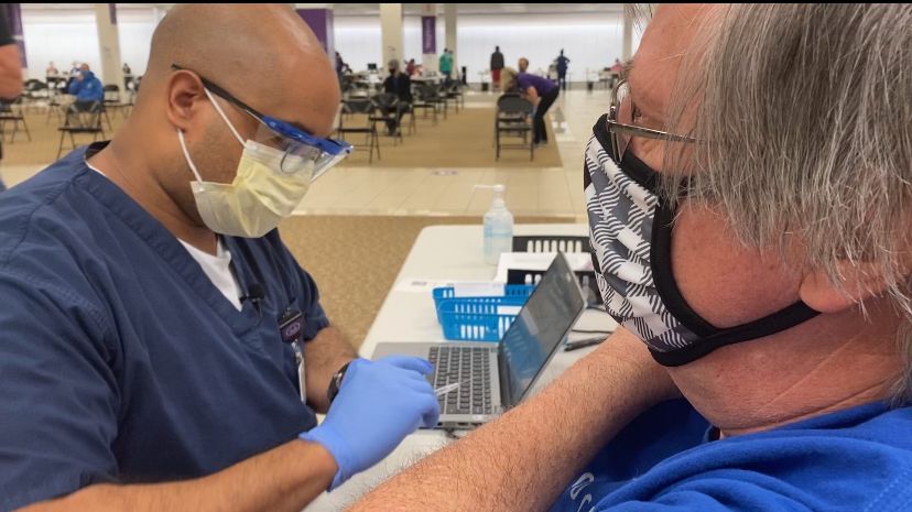 Vaccinators trade long days for sense of hope