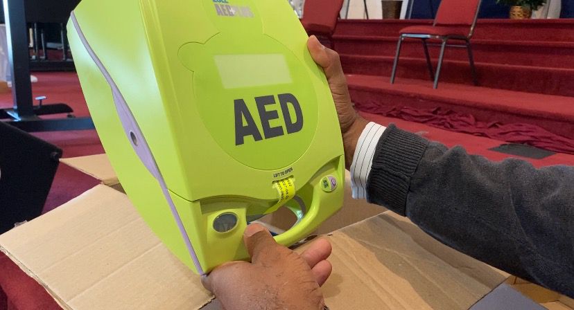 Church gets new AED from Denzel Ward's foundation