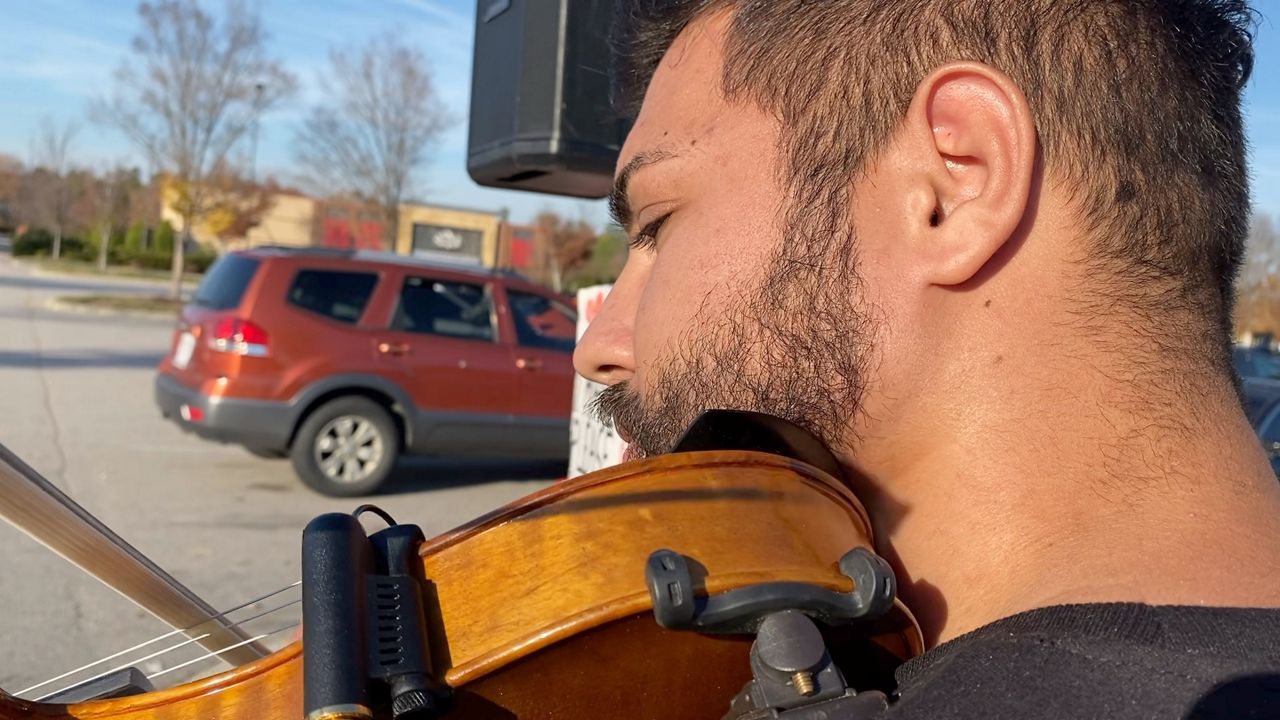 Triangle brings joy through violin music
