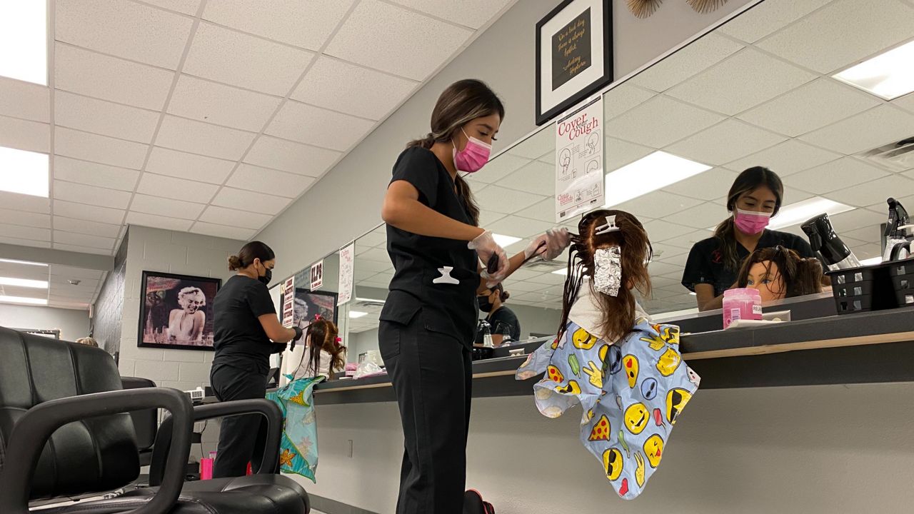 Cosmetology students return to classroom
