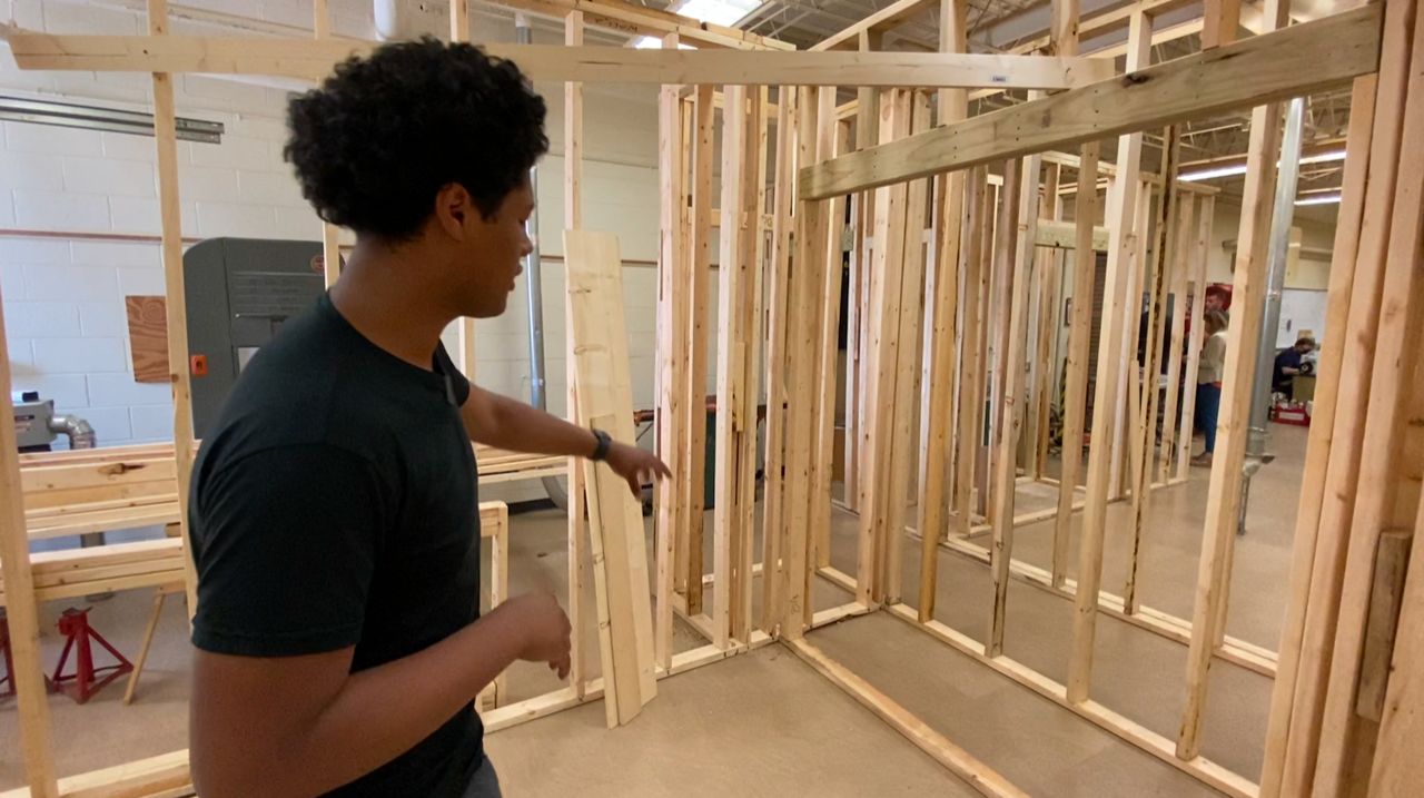 Students build interior walls for three new Racine homes
