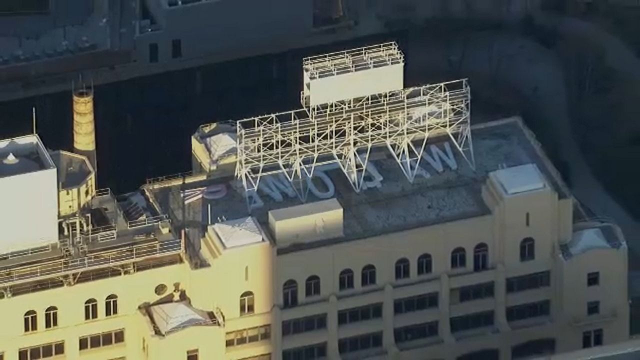 Iconic Watchtower sign removed from Brooklyn Heights