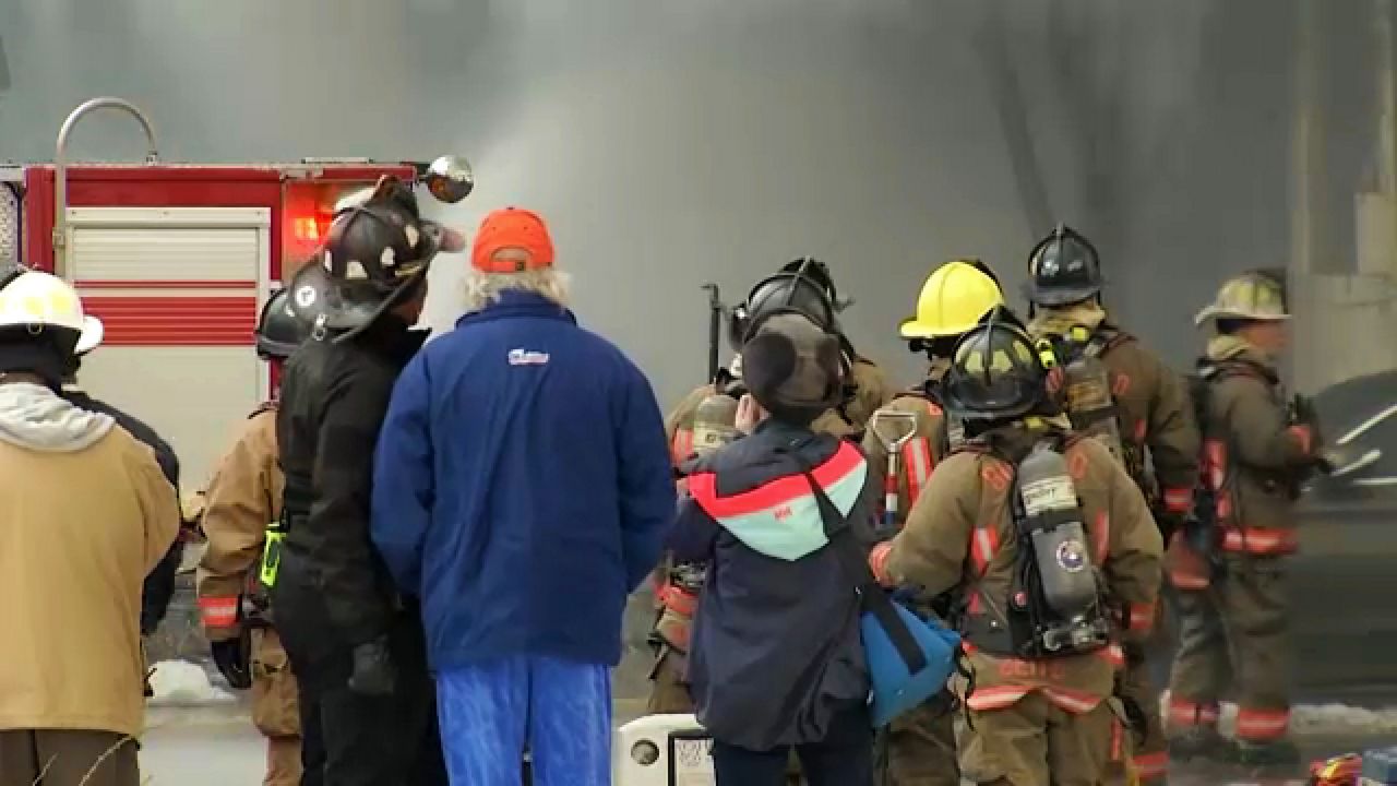 Residents stand with BFD following death of firefighter