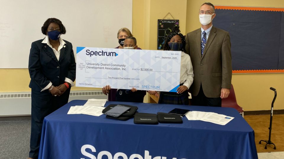 Spectrum Donates Tablets and $2,500 to University District
