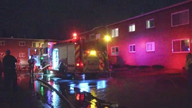 Woman Helped From Building During Fire