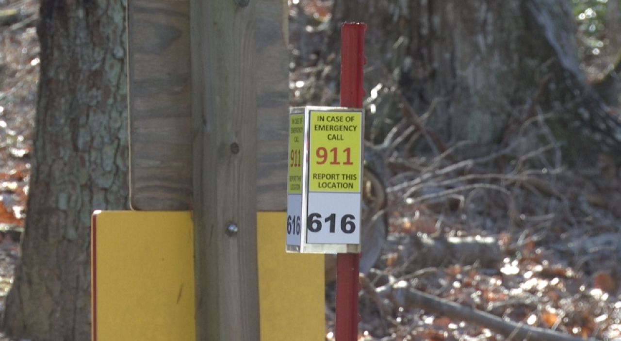 Boy Scout Puts Markers Along Trails at State Park