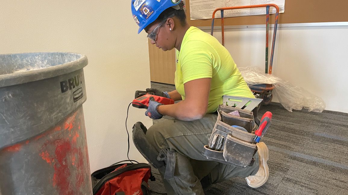 Local carpenter building path for women in construction