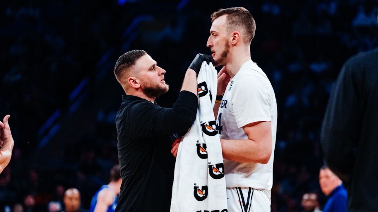 Xavier athletic trainer living dream with basketball team